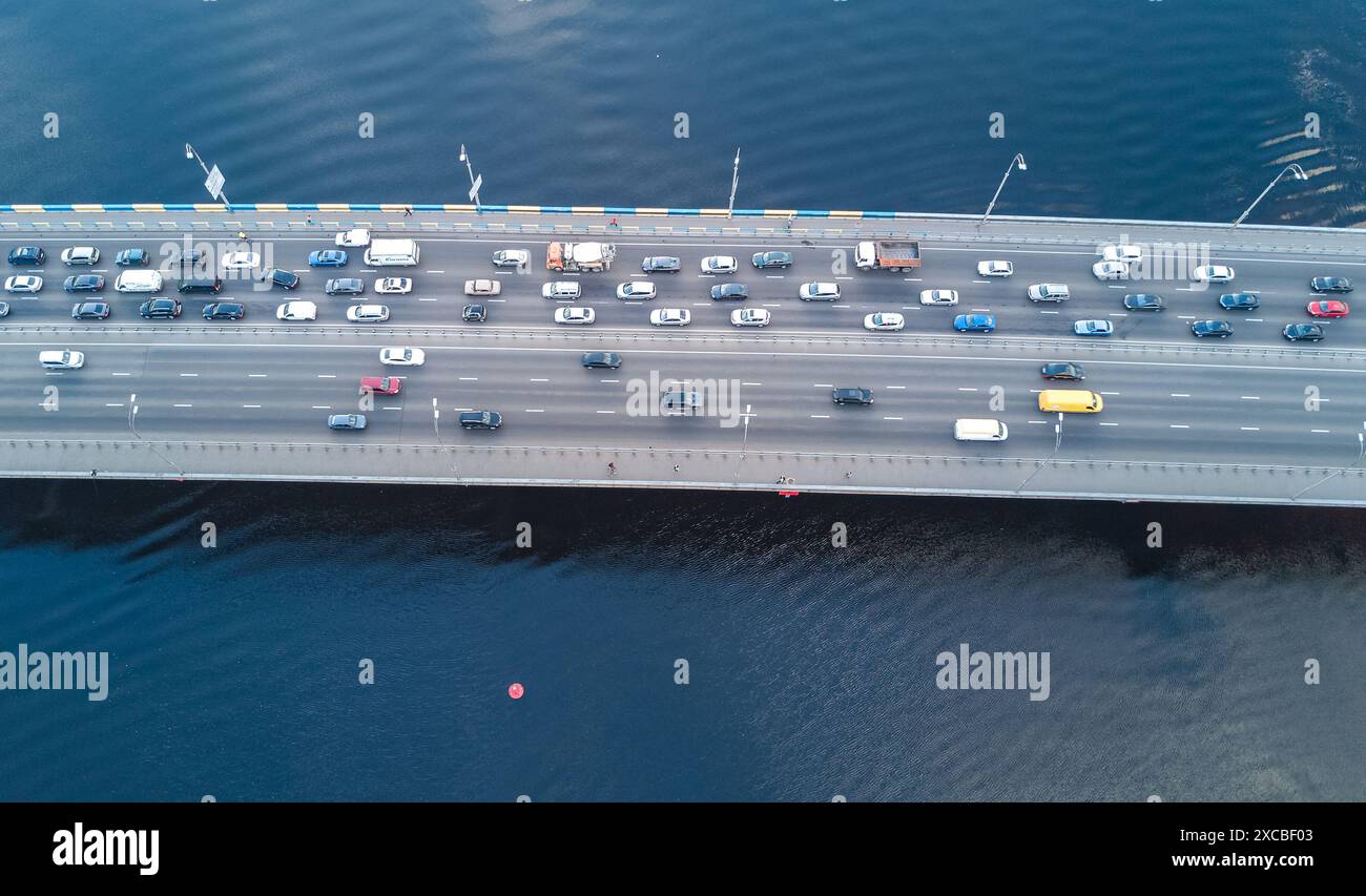 Aerial top view of bridge road automobile traffic jam of many cars from ...