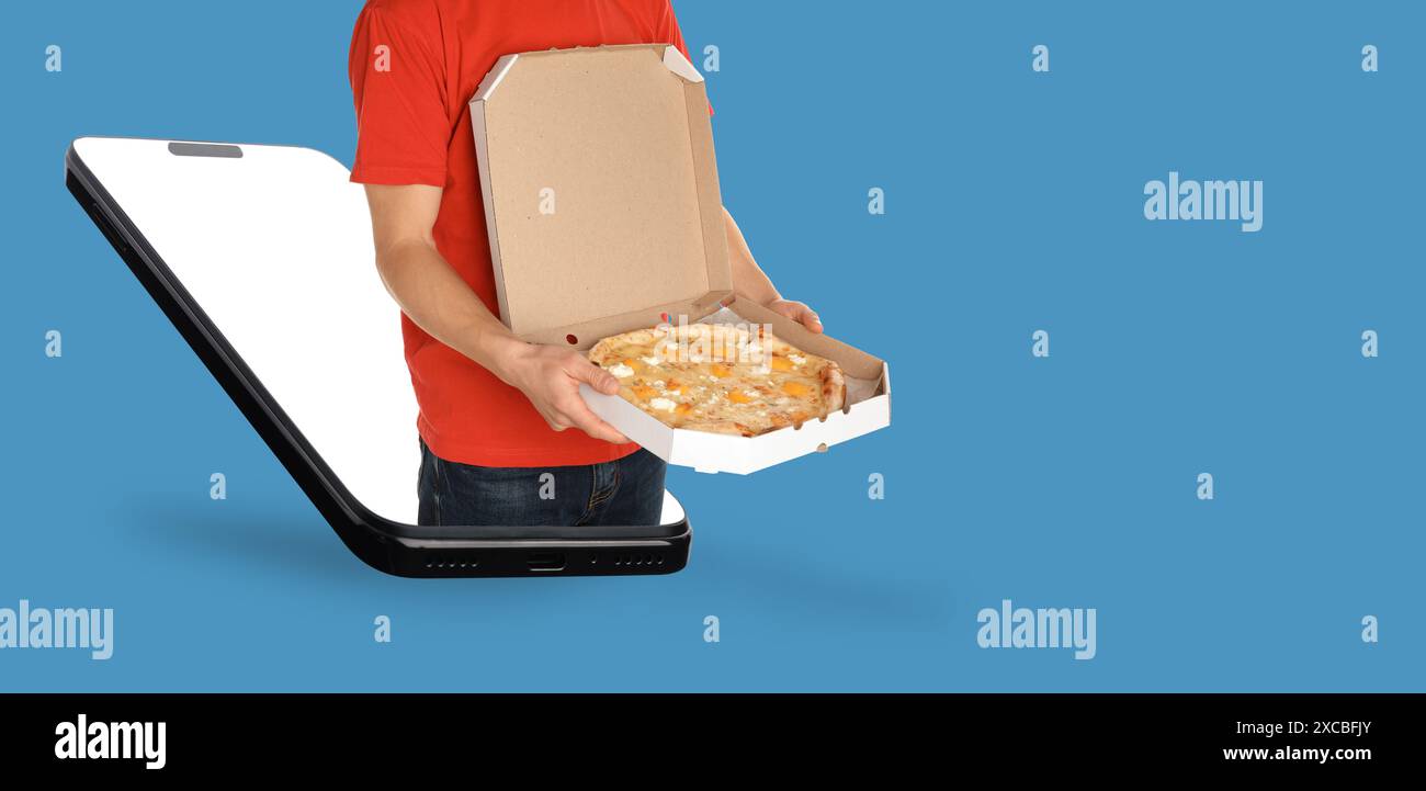Online food ordering. Man with pizza sticking out of smartphone screen ...