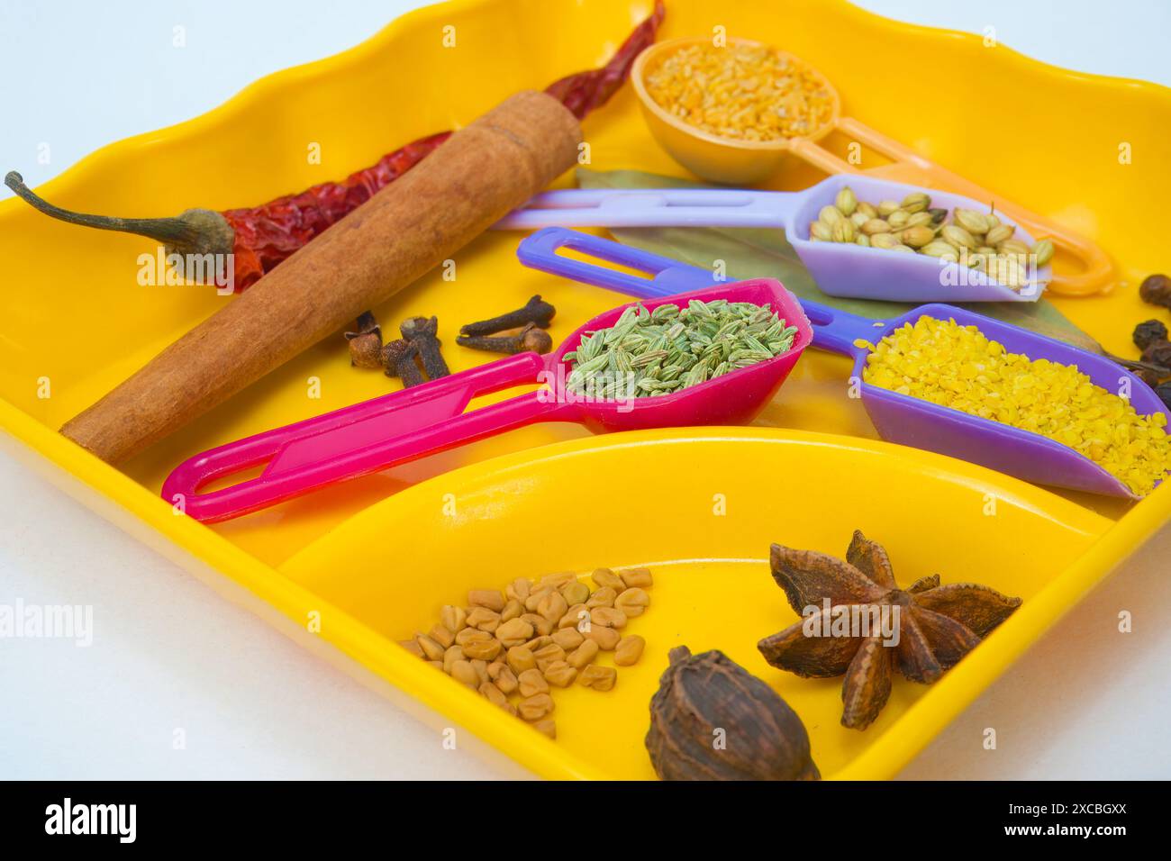 corner view of Mixed indian spices for mango pickle like, red chilli ...