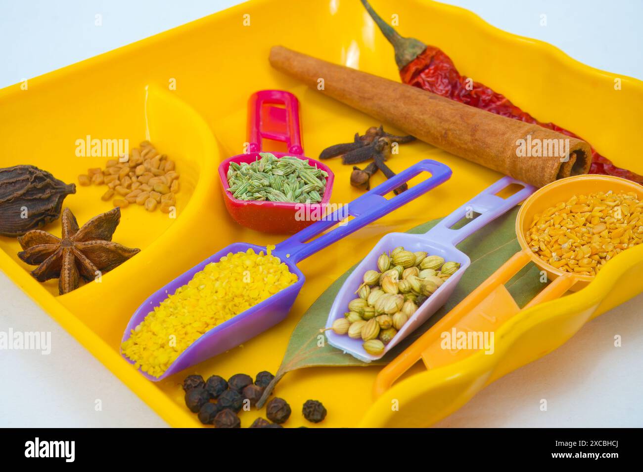 corner view of Mixed indian spices for mango pickle like, red chilli ...