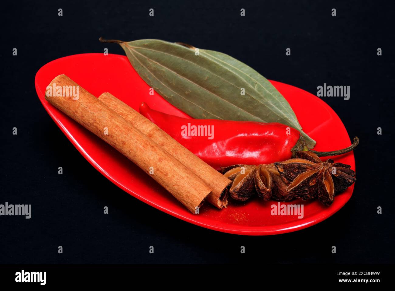 side view of star anise, also known as badian, red chilli, tow piece of ...