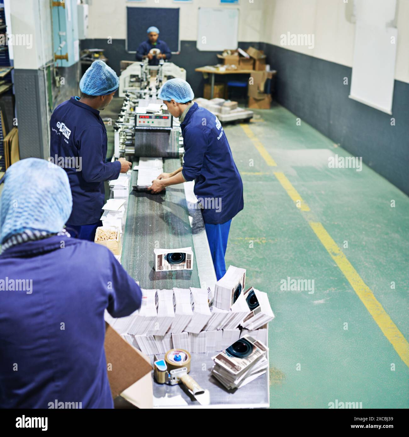 Team, people and manufacturing paper for printing by machine, assembly ...