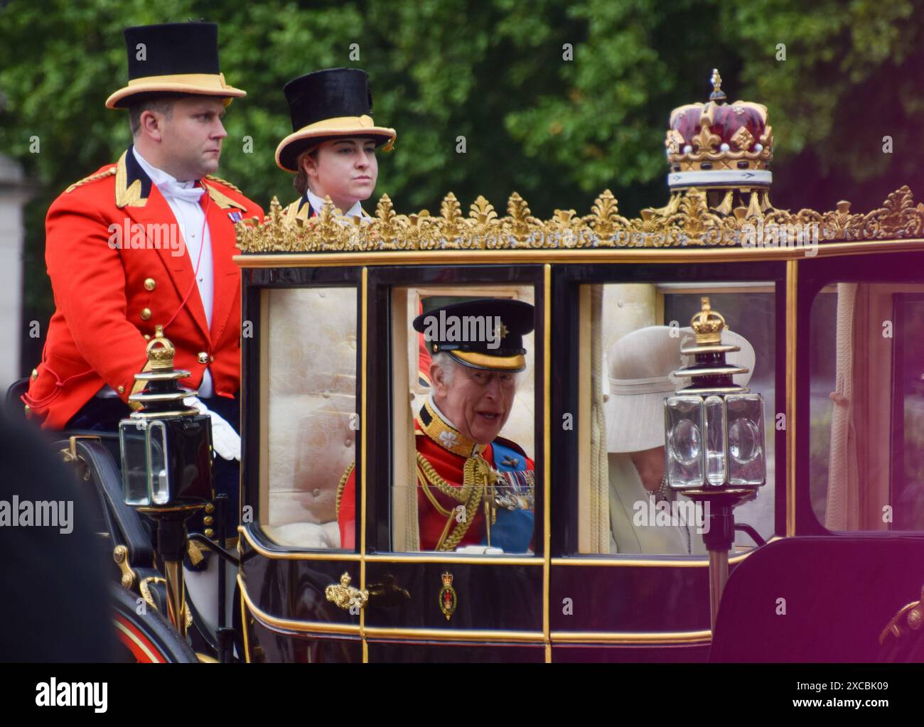 London, UK. 15th June 2024. King Charles III and Queen Camilla ride in ...