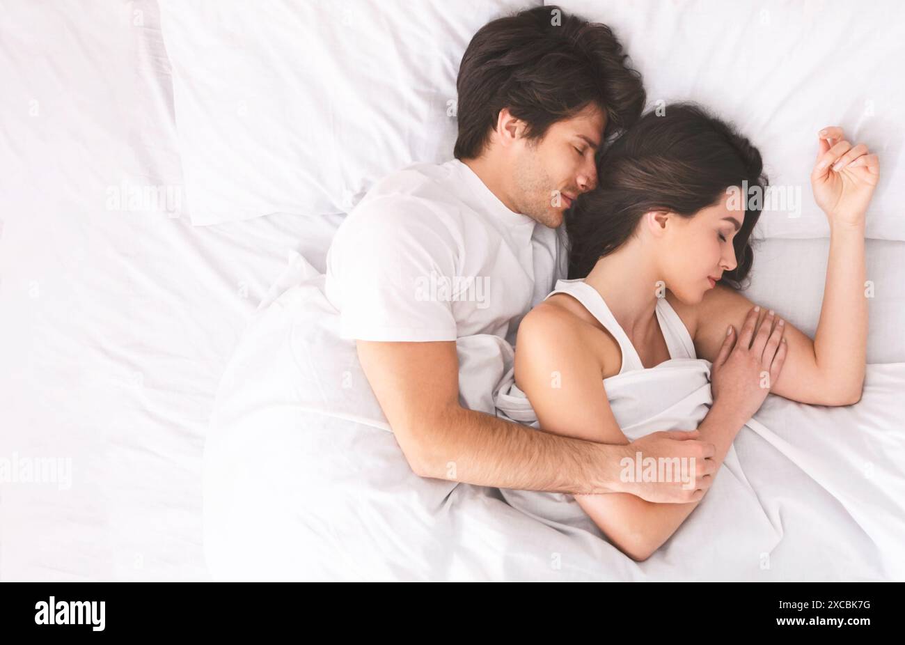 Couple Sleeping Together in Bed, Arms Wrapped Around Each Other Stock ...