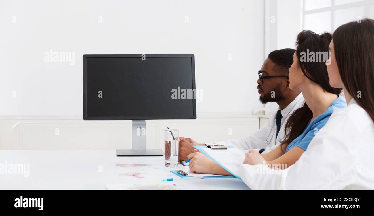 Diverse doctors having video conference hi-res stock photography and ...