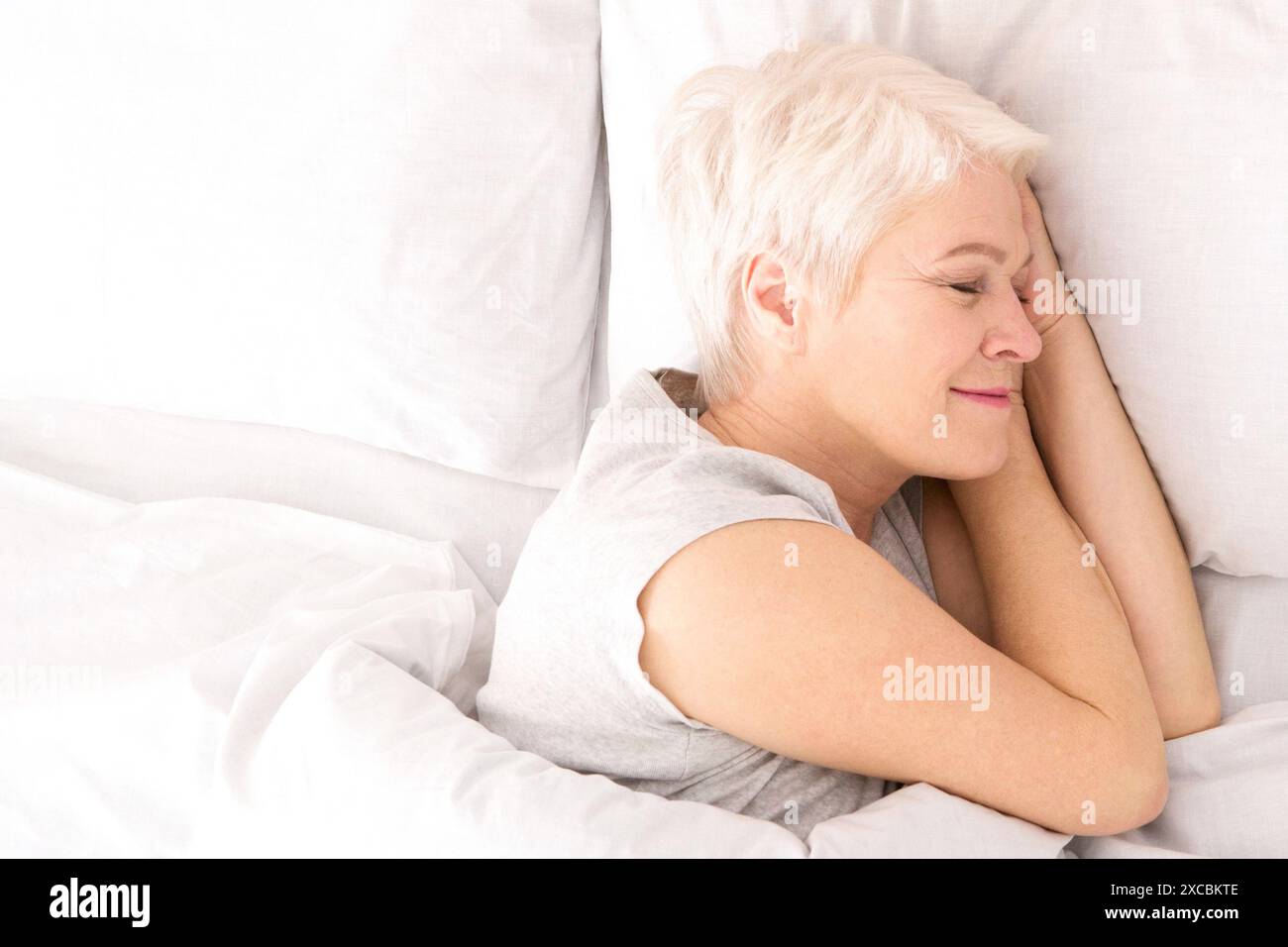 Woman Laying in Bed With White Sheets, View Above Stock Photo - Alamy