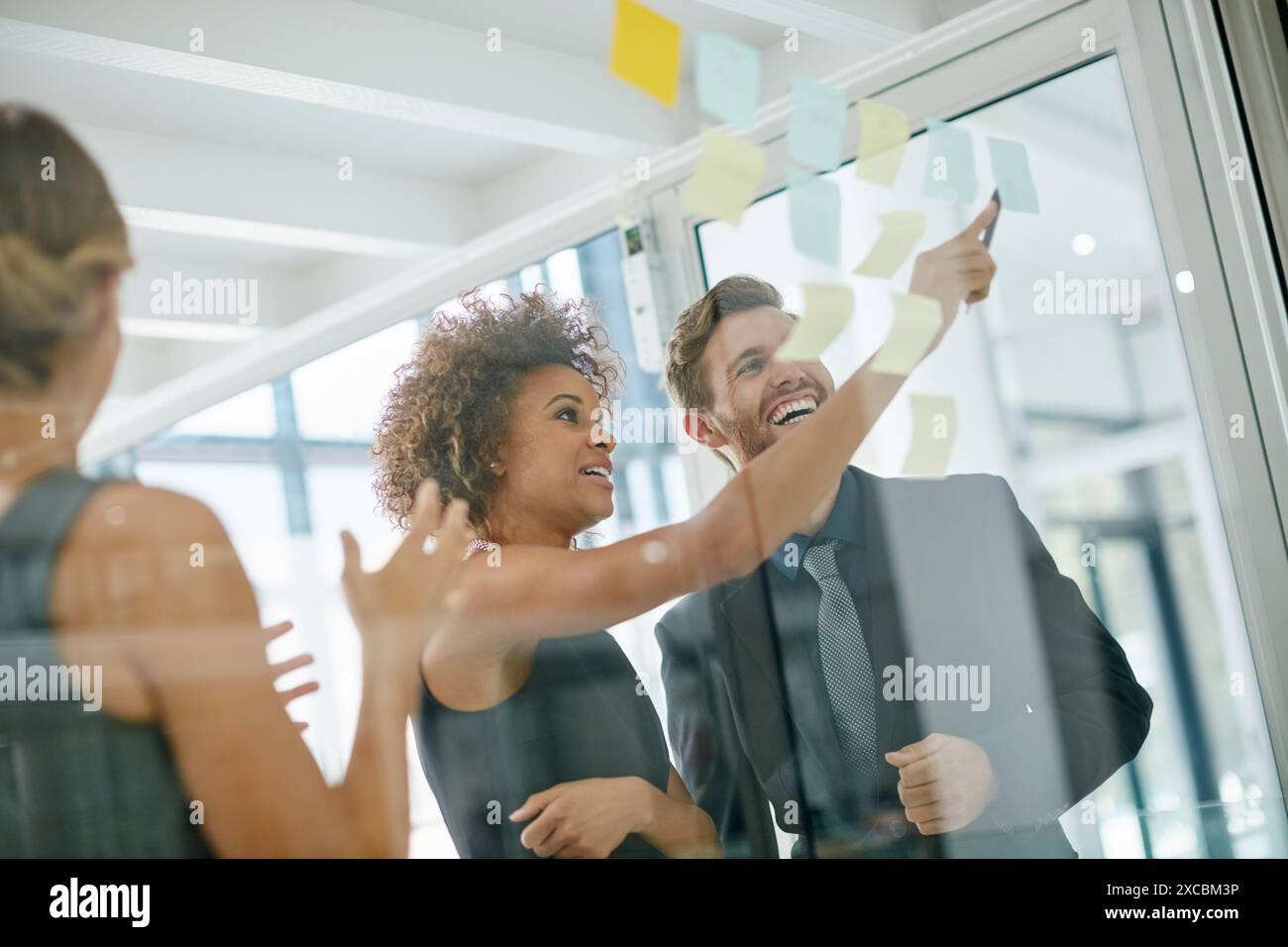 Glass wall, ideas and business people with brainstorming, teamwork and ...