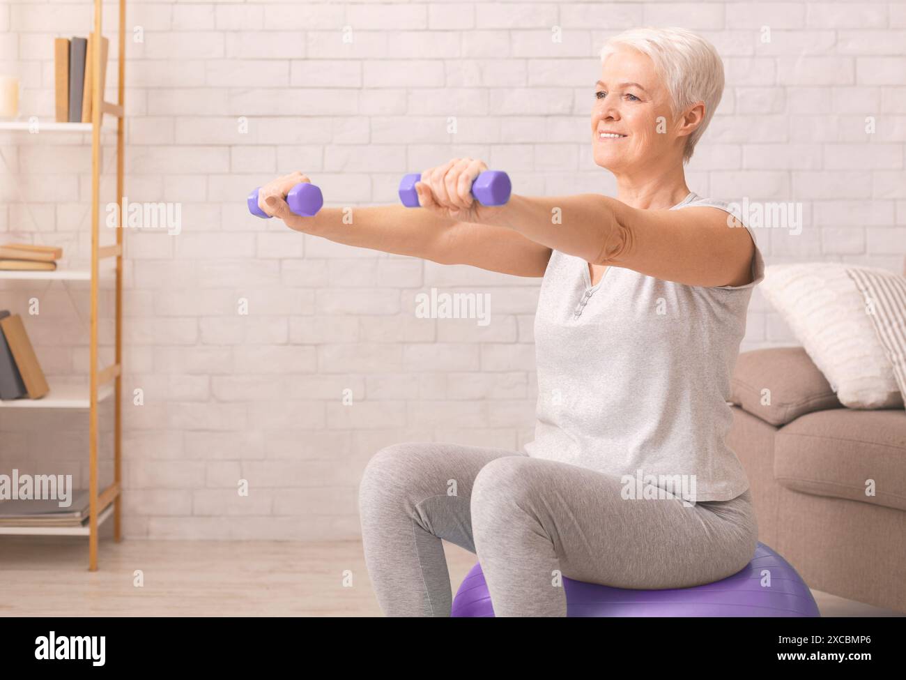Old woman flexibility exercises hi-res stock photography and images - Alamy