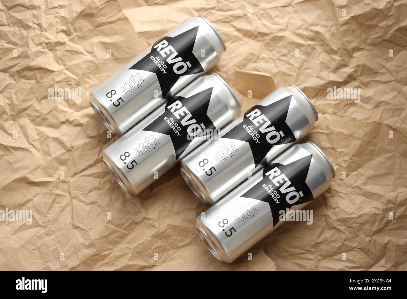 KYIV, UKRAINE - APRIL 20, 2024 Cans of Revo alco energy drink in new ...