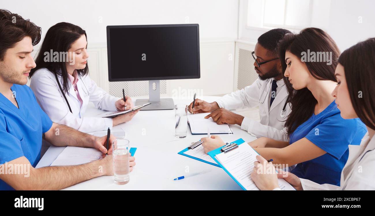 Doctor And Interns Having Online Lecture In Meeting Room Stock Photo ...