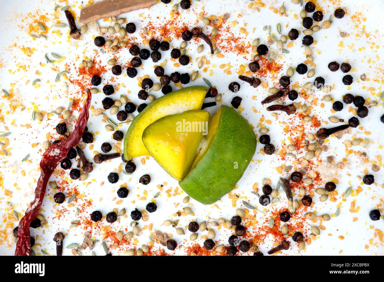 Very close-up and top view of sprinkled indian spices for mango pickle ...