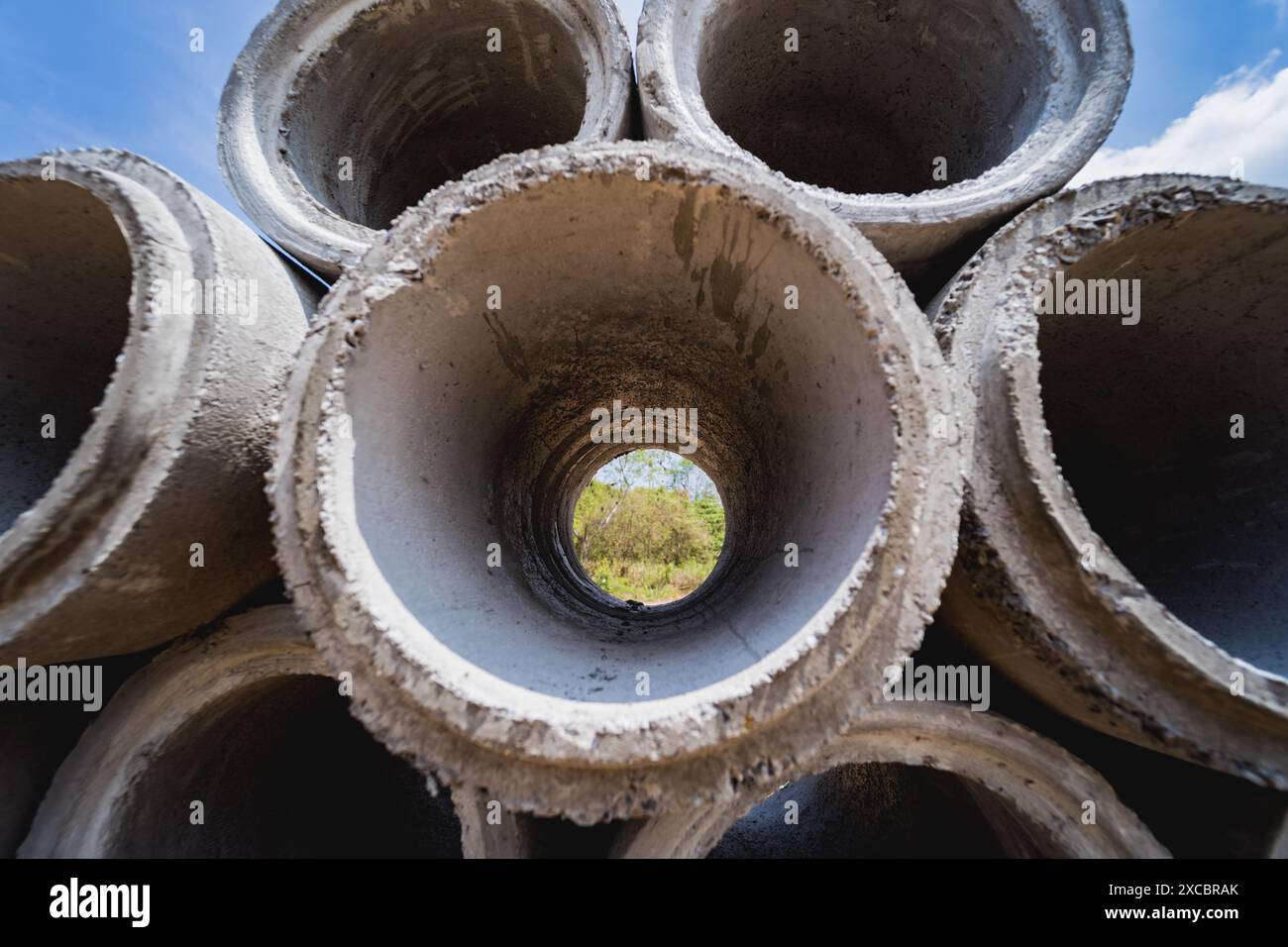 A stack of concrete ring pipes piled and creating a symmetrical ...