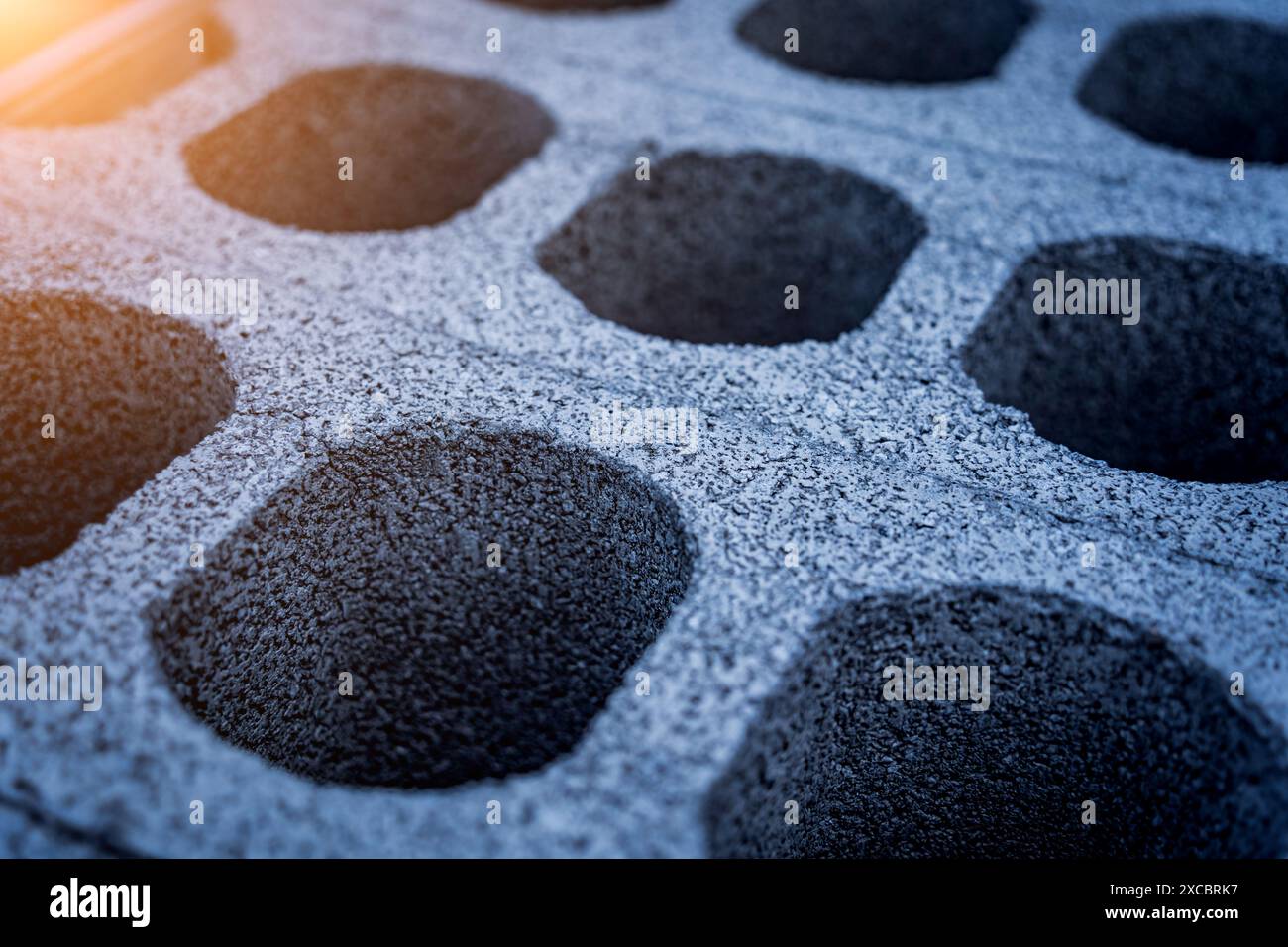 Concrete blocks with holes stacked on top of each other Stock Photo - Alamy
