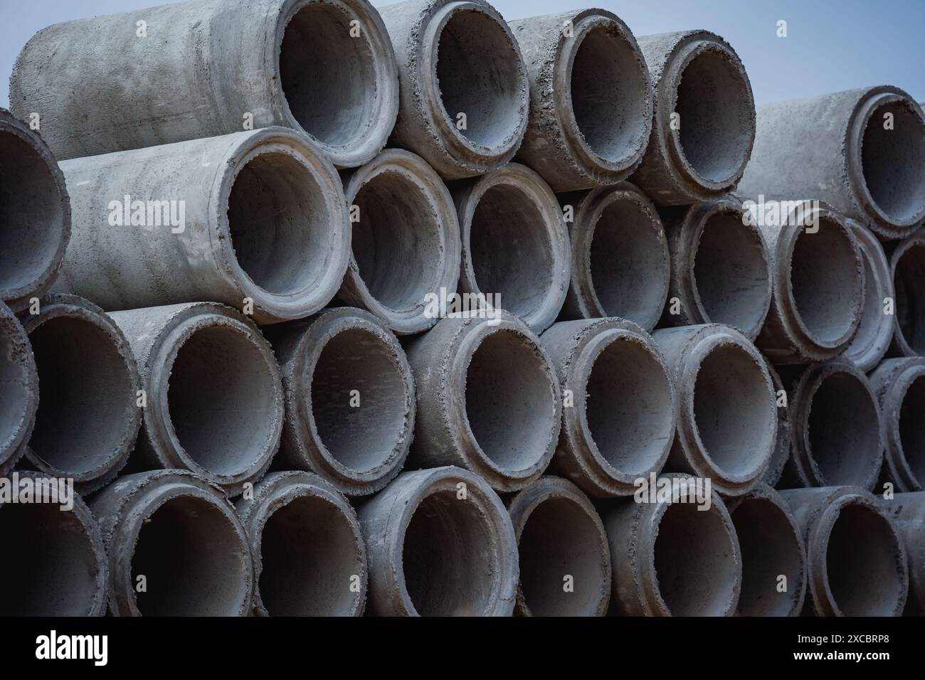A stack of concrete ring pipes piled and creating a symmetrical ...