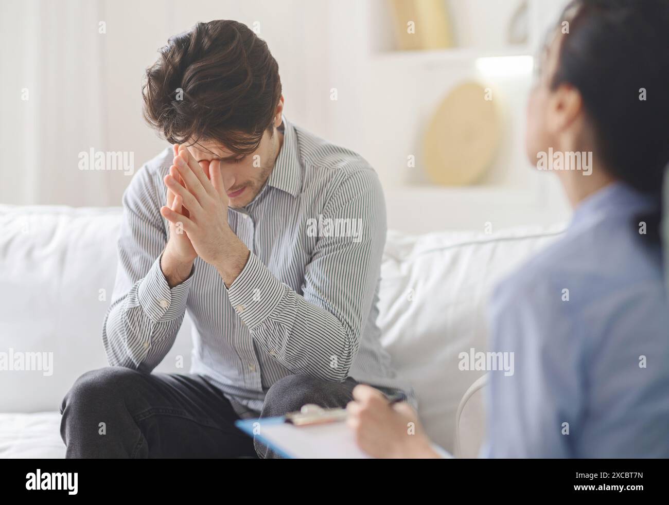 Distressed Man in Therapy Session Discussing Personal Issues Stock ...