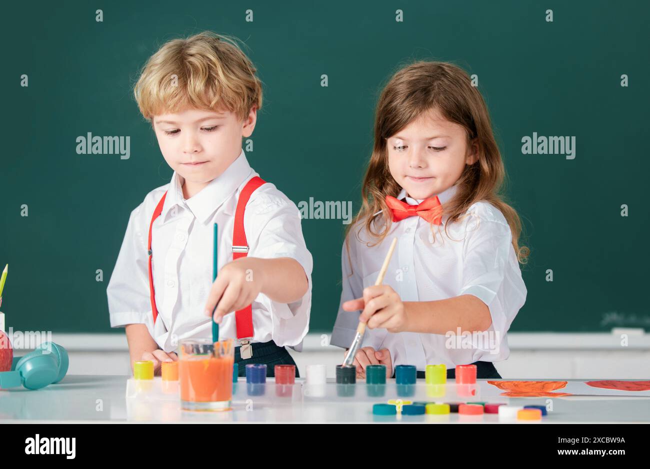 Portrait school kids doing art homework. Children drawing on elementary ...