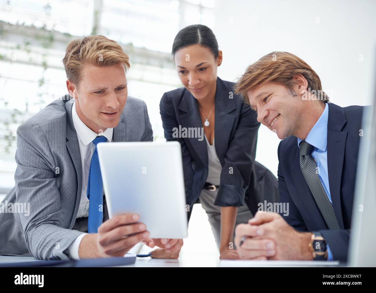 Business people, tablet and research for project in office ...