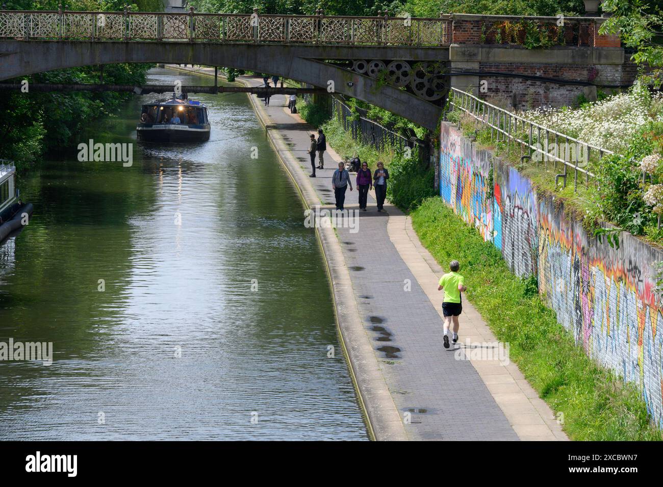 London, UK. Man jogging along the Regents Canal just north of Camden ...