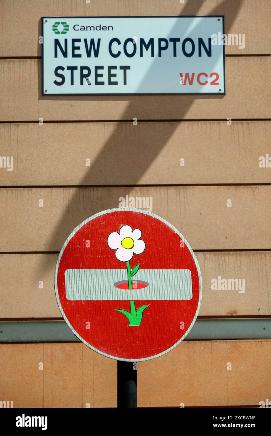 London, UK. Altered No Entry sign in New Compton Street next to the ...