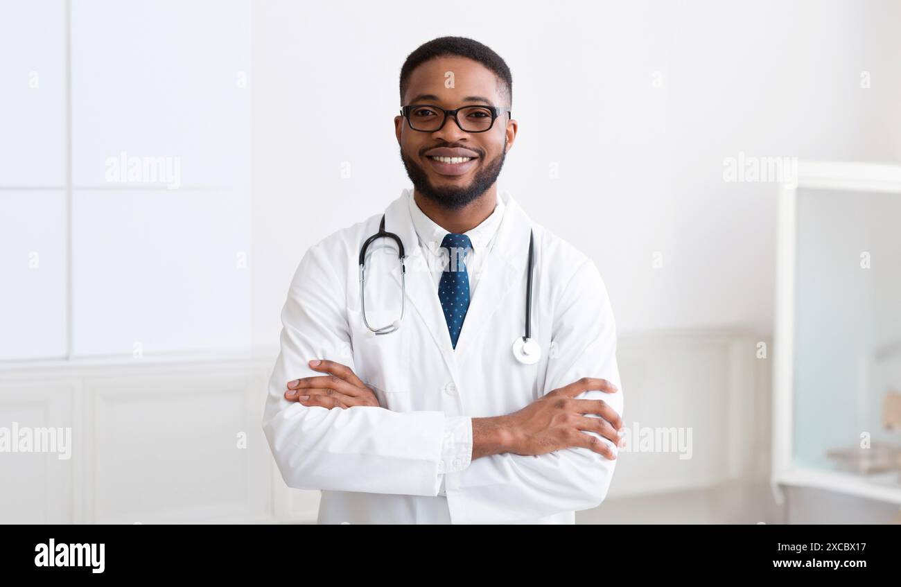 Caucasian doctor talking camera during hi-res stock photography and ...
