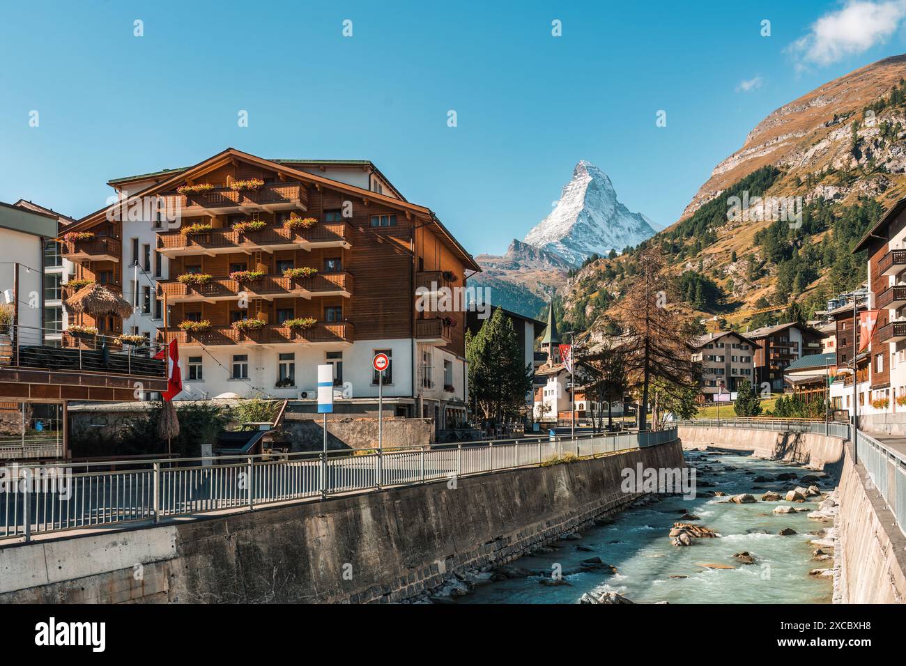 View of Zermatt downtown with Matterhorn mountain and canal in autumn ...