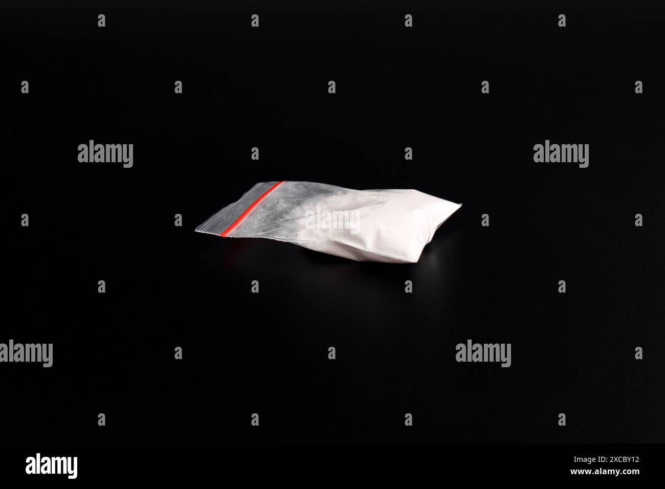 Cocaine in plastic packet isolated on black background. illustration of ...