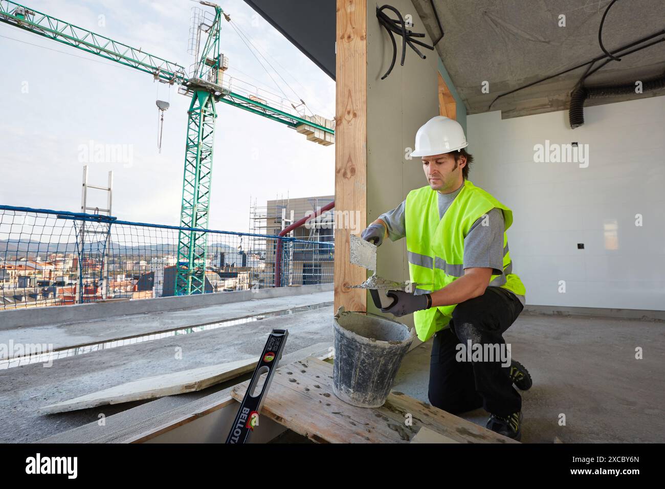 Mason with trowel, Bricklayer with personal protective equipment, PPE ...