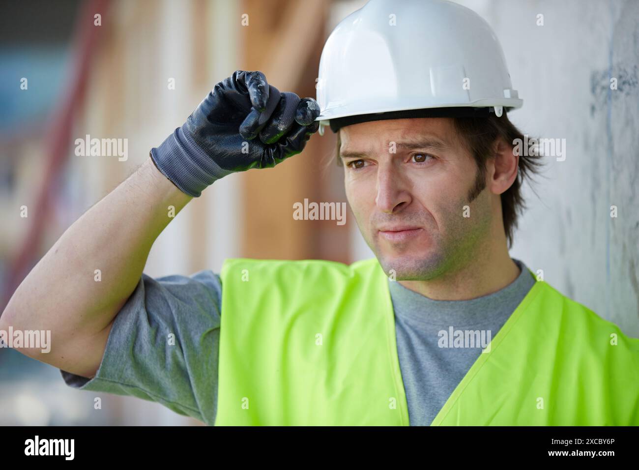 Mason, Bricklayer with personal protective equipment, PPE, Apartment ...