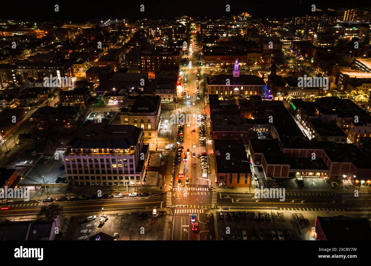 An Aerial night view of a cityscape with illuminated streets and ...