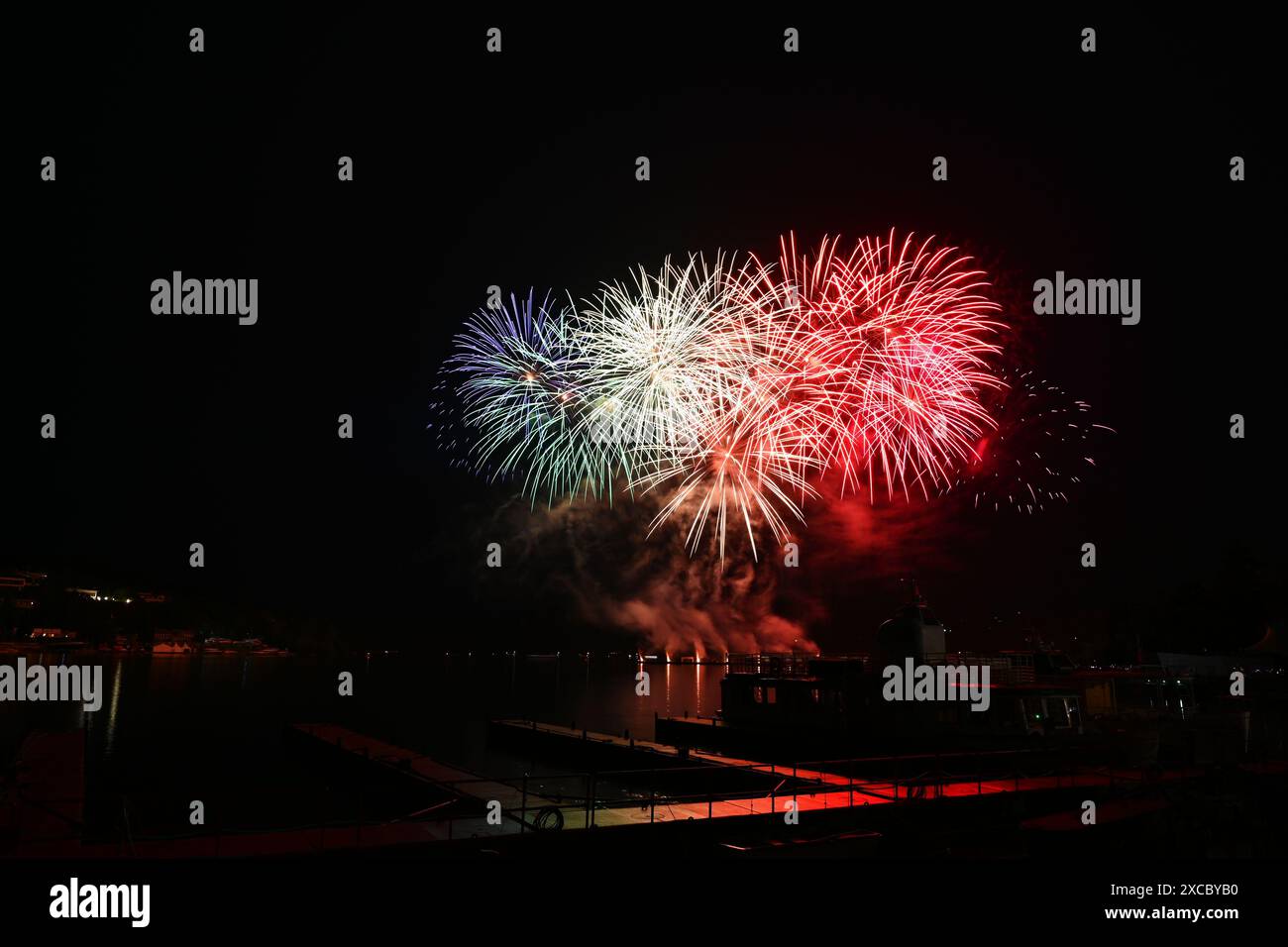Beautiful colorful fireworks with reflections in water. Brno dam, the ...