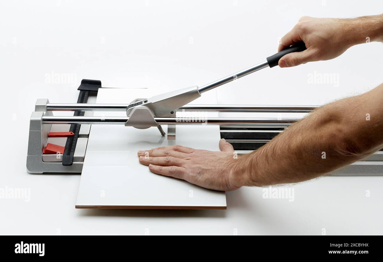 Manual tile cutter. Cutting tile. Construction Industry Stock Photo - Alamy