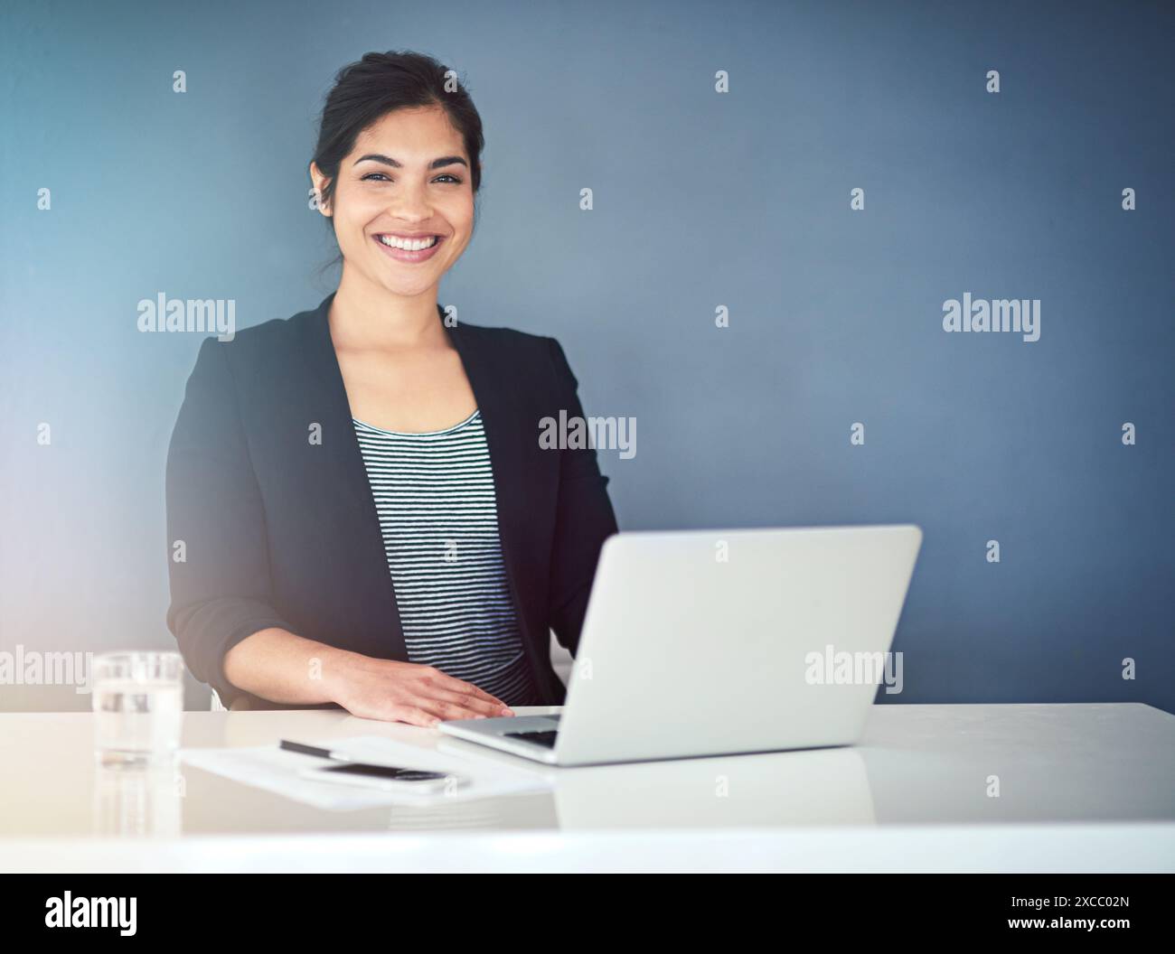 Office, portrait and business woman with laptop for typing, research ...