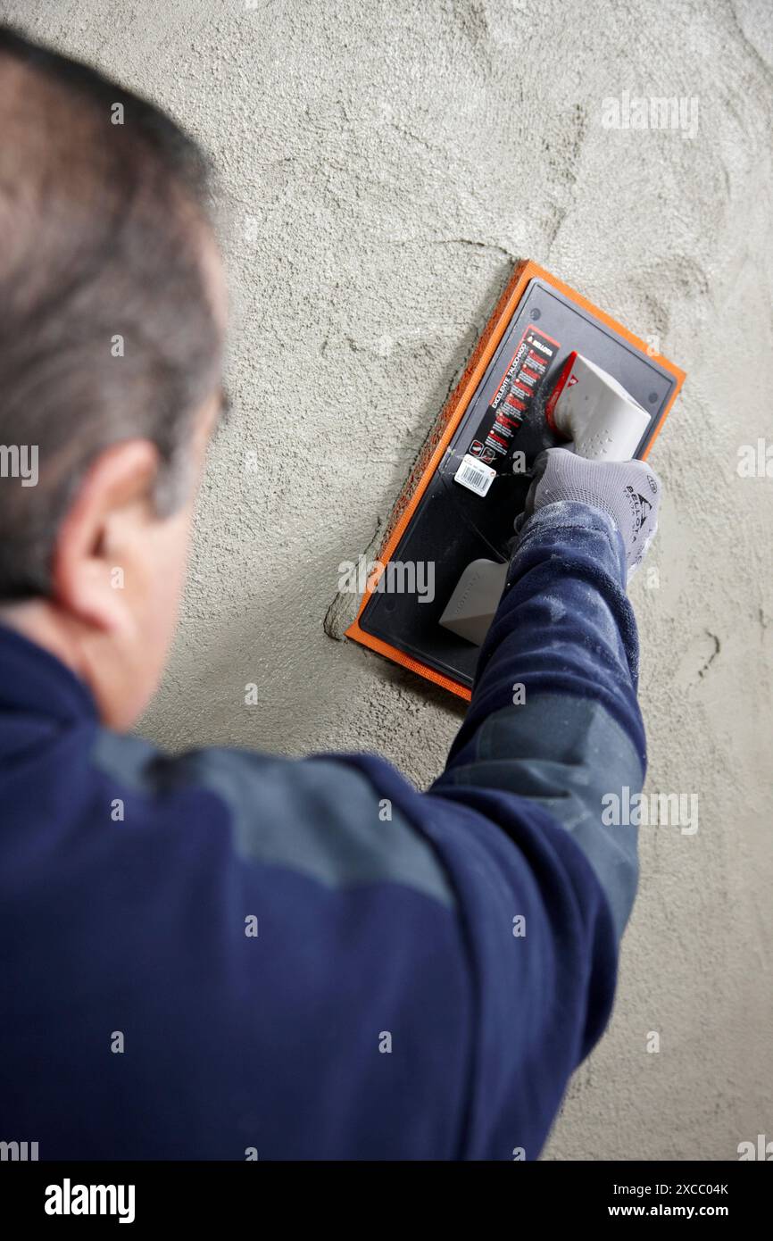 Roughcast, grout float, new homes under construction, construction site ...