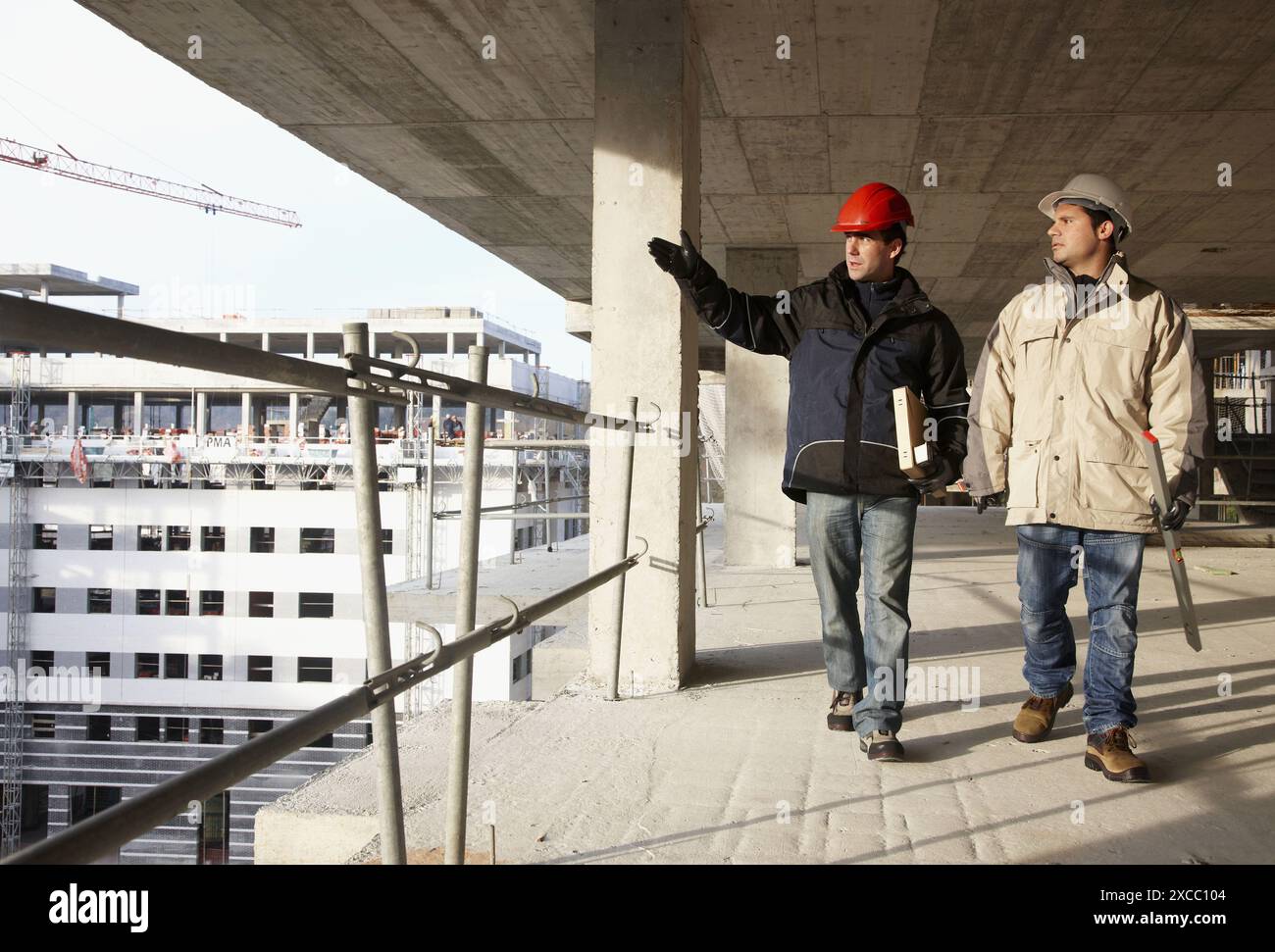 Architect and construction worker, personal protective equipment ...