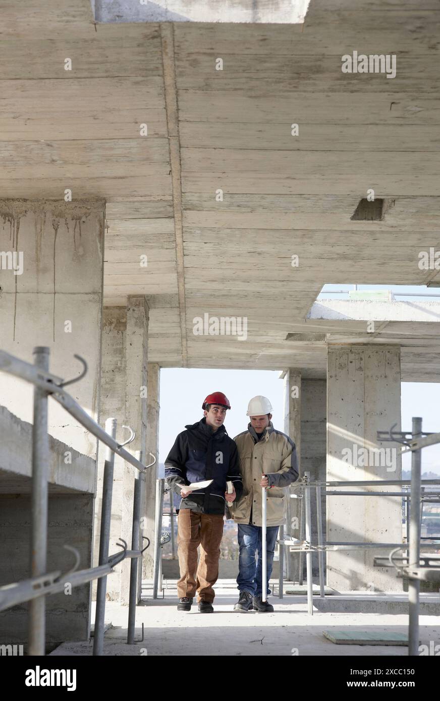 Architect and construction worker, personal protective equipment ...