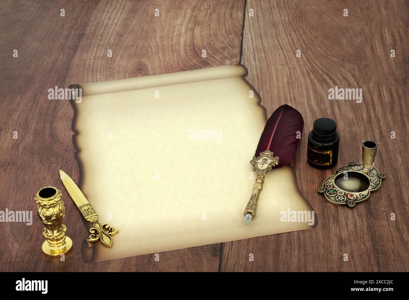 Parchment paper scroll with old feather quill pen, ink, letter opener ...