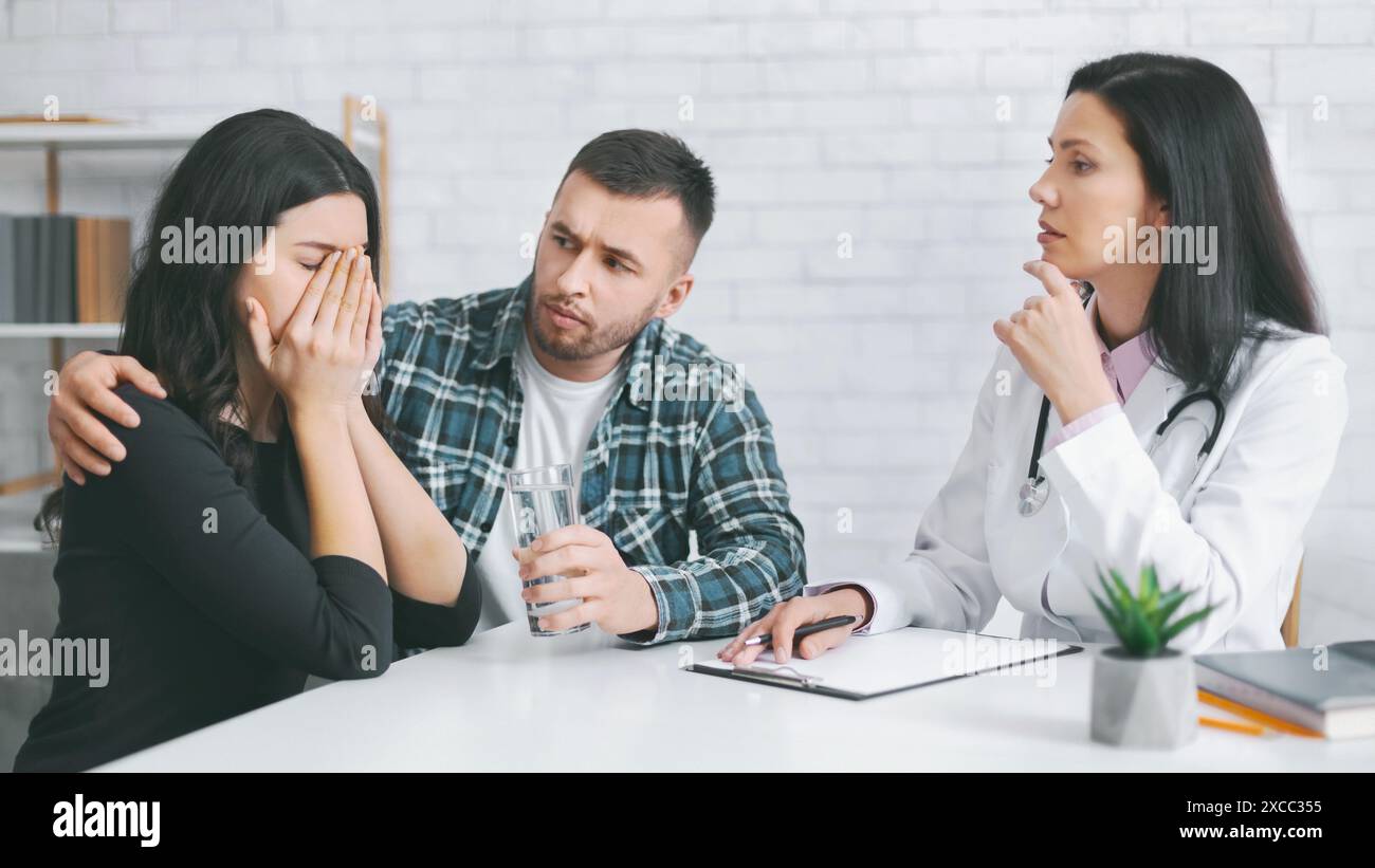 Woman Crying During Doctor Visit With Her Partner Stock Photo - Alamy
