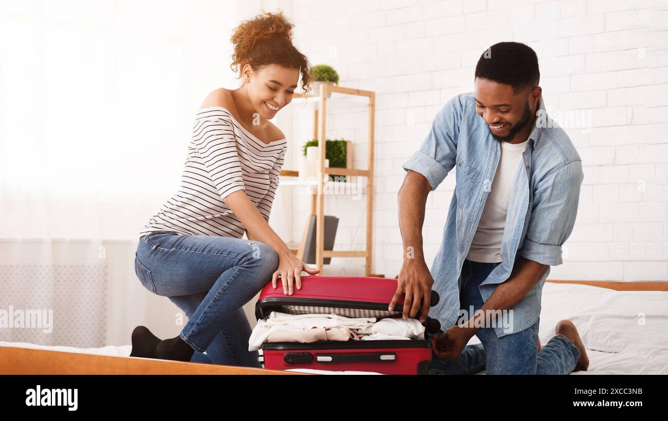 African american couple sorting suitcase hi-res stock photography and ...