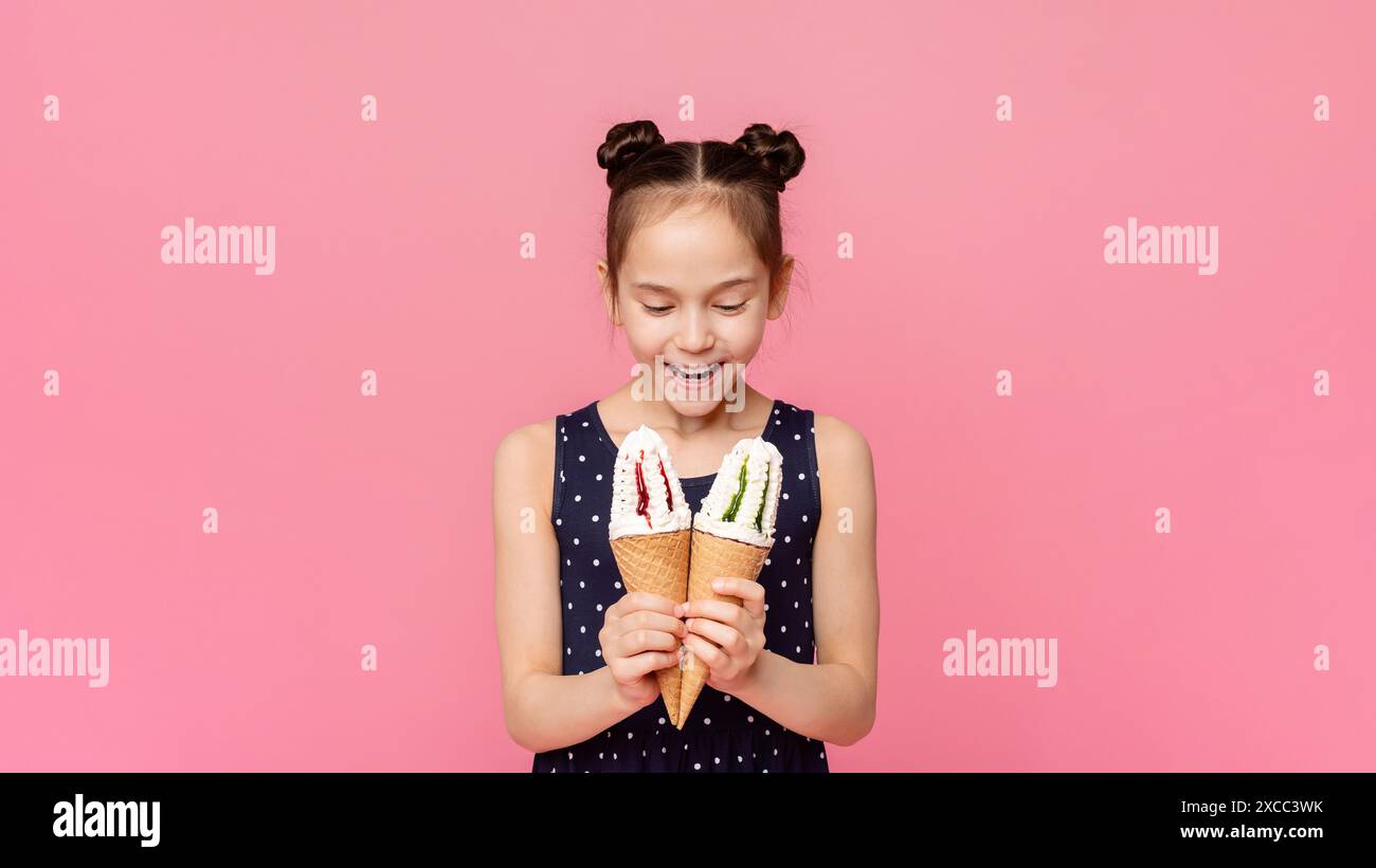 Happy and surprised girl looking at two ice cream cones Stock Photo - Alamy