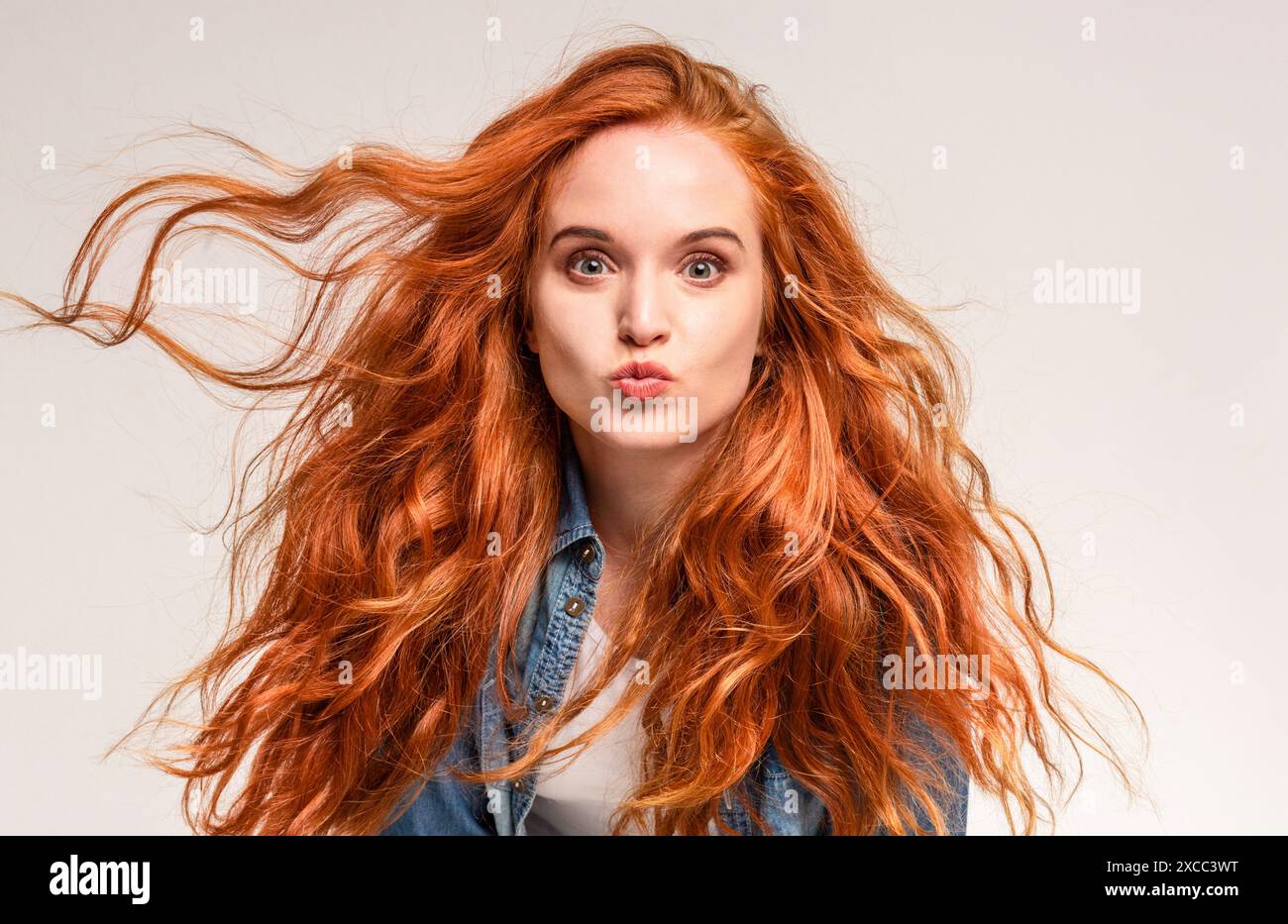 Joyful young woman flowing red hi-res stock photography and images - Alamy