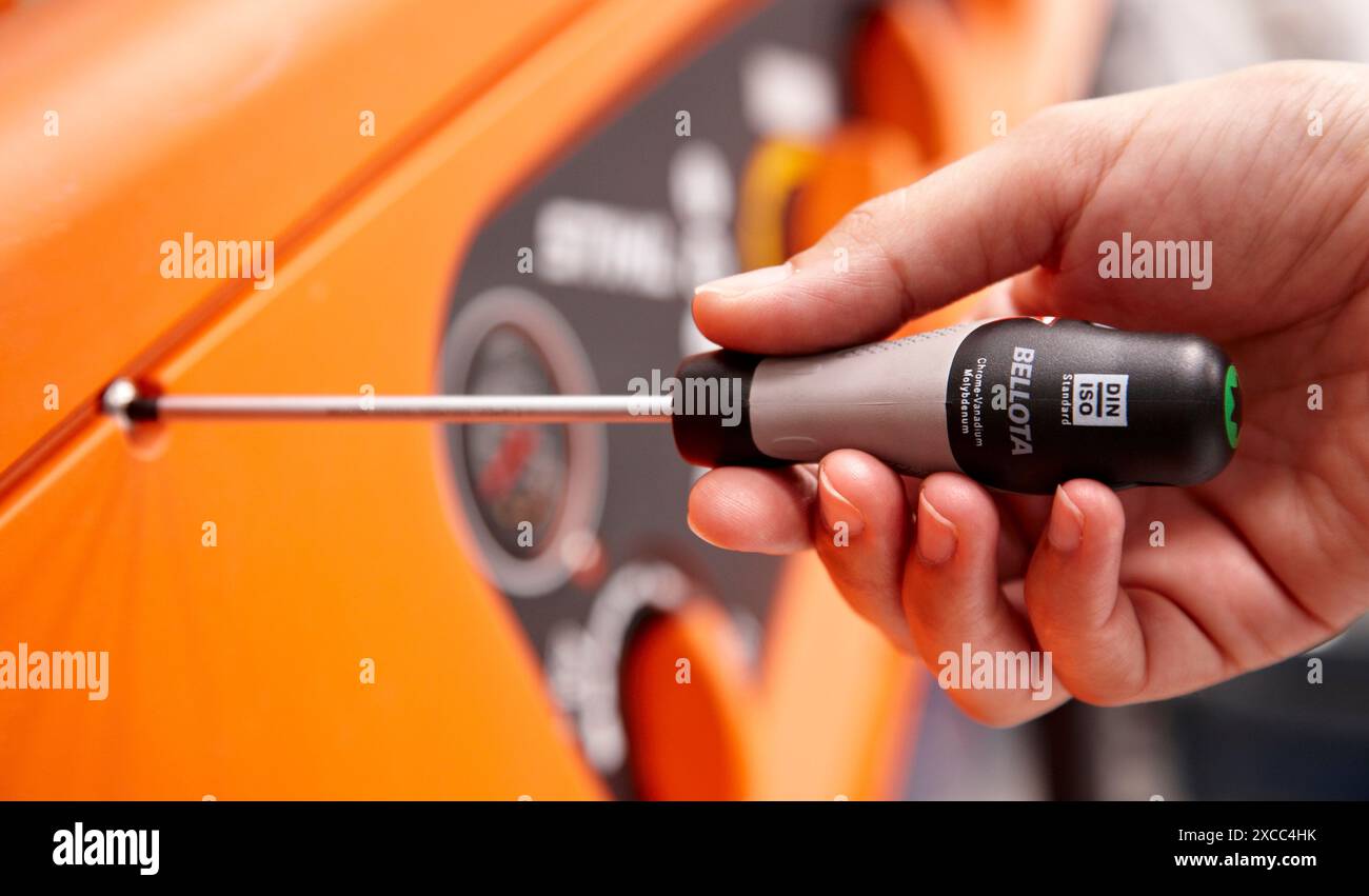 Worker using screwdriver in hi-res stock photography and images - Alamy