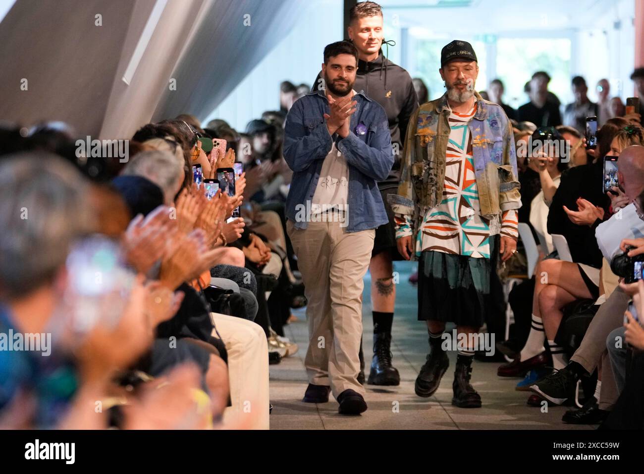 Creative directors Simone Botte and Filippo Leone Maria Biraghi accept applause at the end of ...