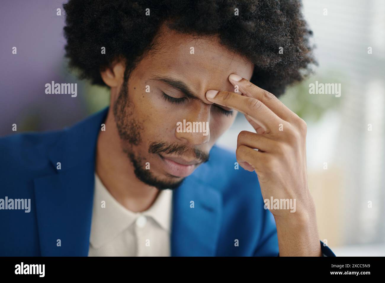 Stressed and tired businessman working on difficult project Stock Photo ...