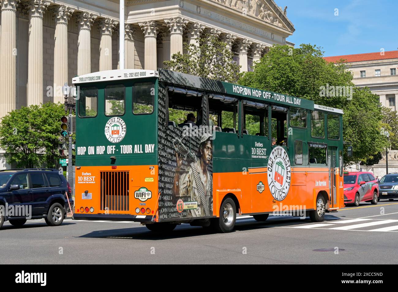Washington DC, USA - 2 May 2024: Old town trolley hop on hop off tourist sightseeing bus driving ...