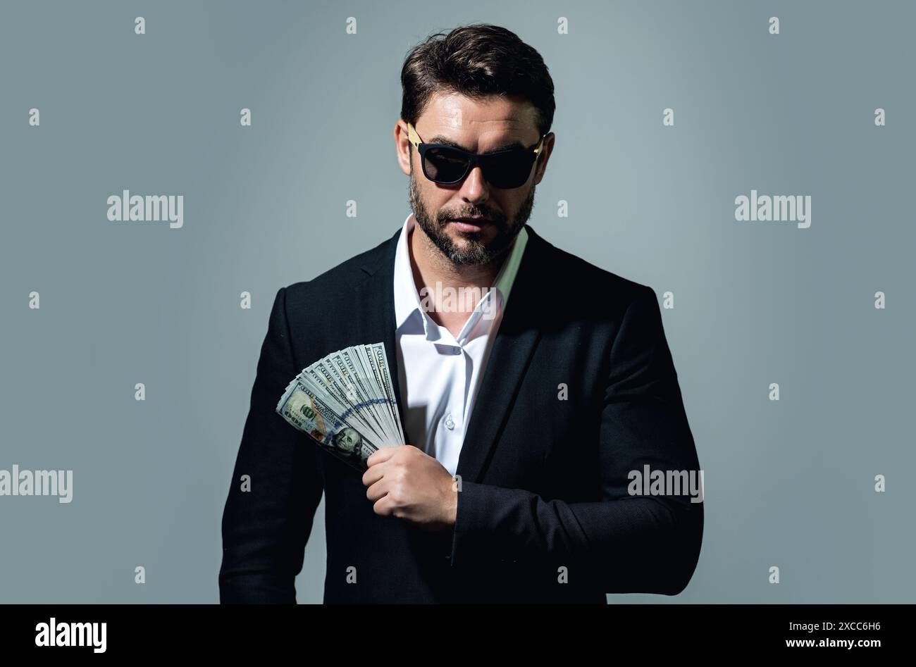 Successful business man counting money. Handsome middle age man holding ...