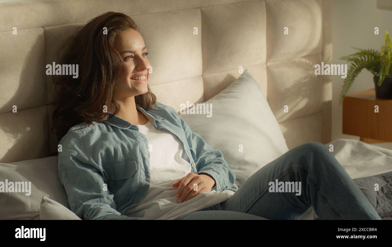 Man falling on bed woman couple female male tickling laughing bedroom ...