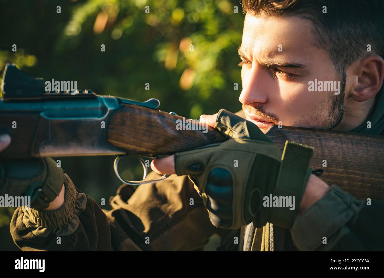 Close up snipers carbine at the outdoor hunting. Gun rifle. Hunter with ...