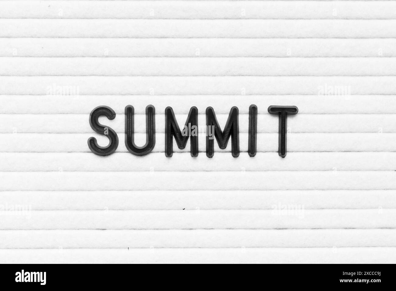 Black color letter in word summit on white felt board background Stock ...