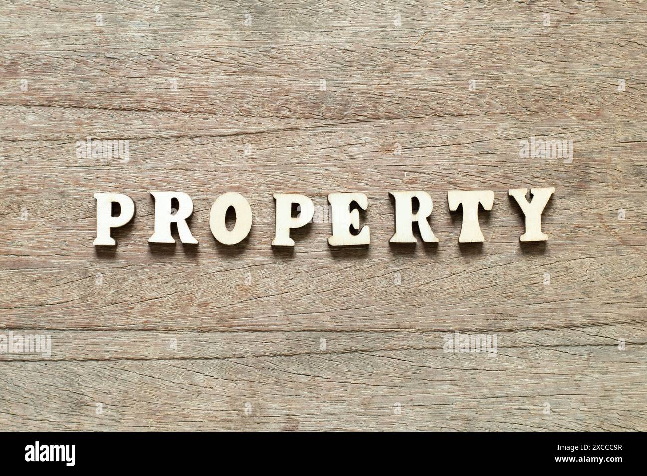 Alphabet letter block in word property on wood background Stock Photo ...