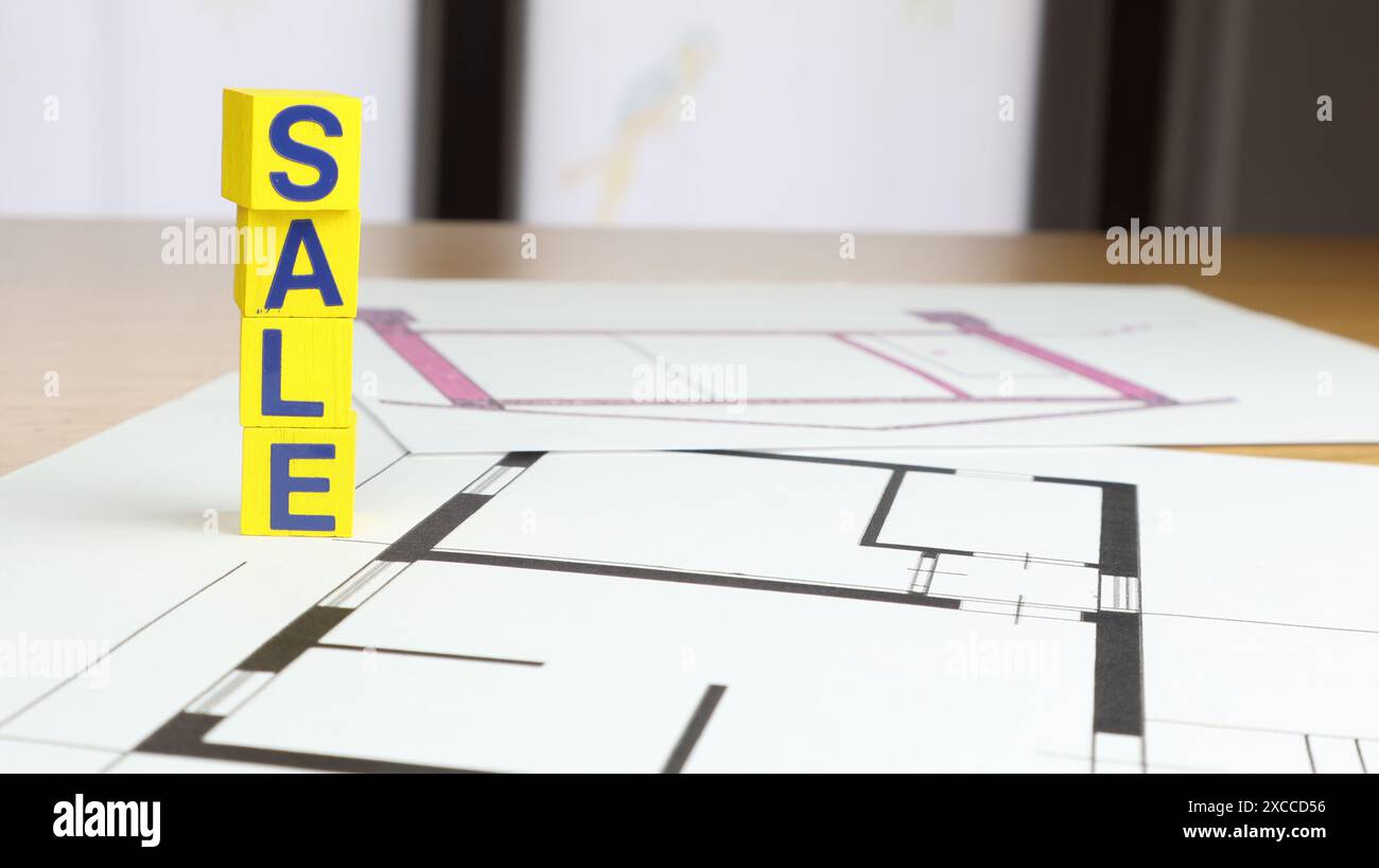 Sale sign made of wooden cubes, interior apartment design background ...